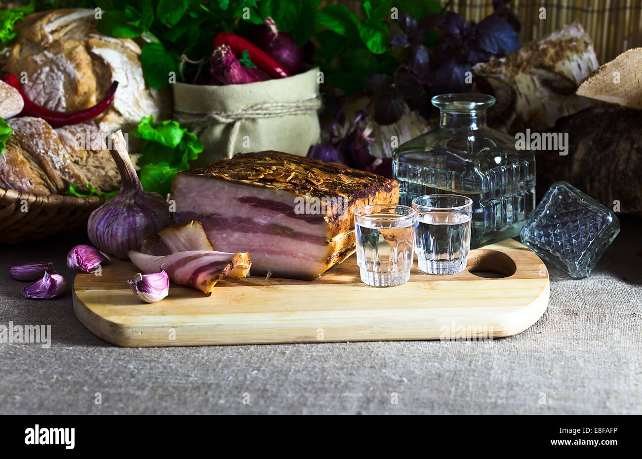 Vodka and smoked meat on a kichen table Stock Photo - Alamy