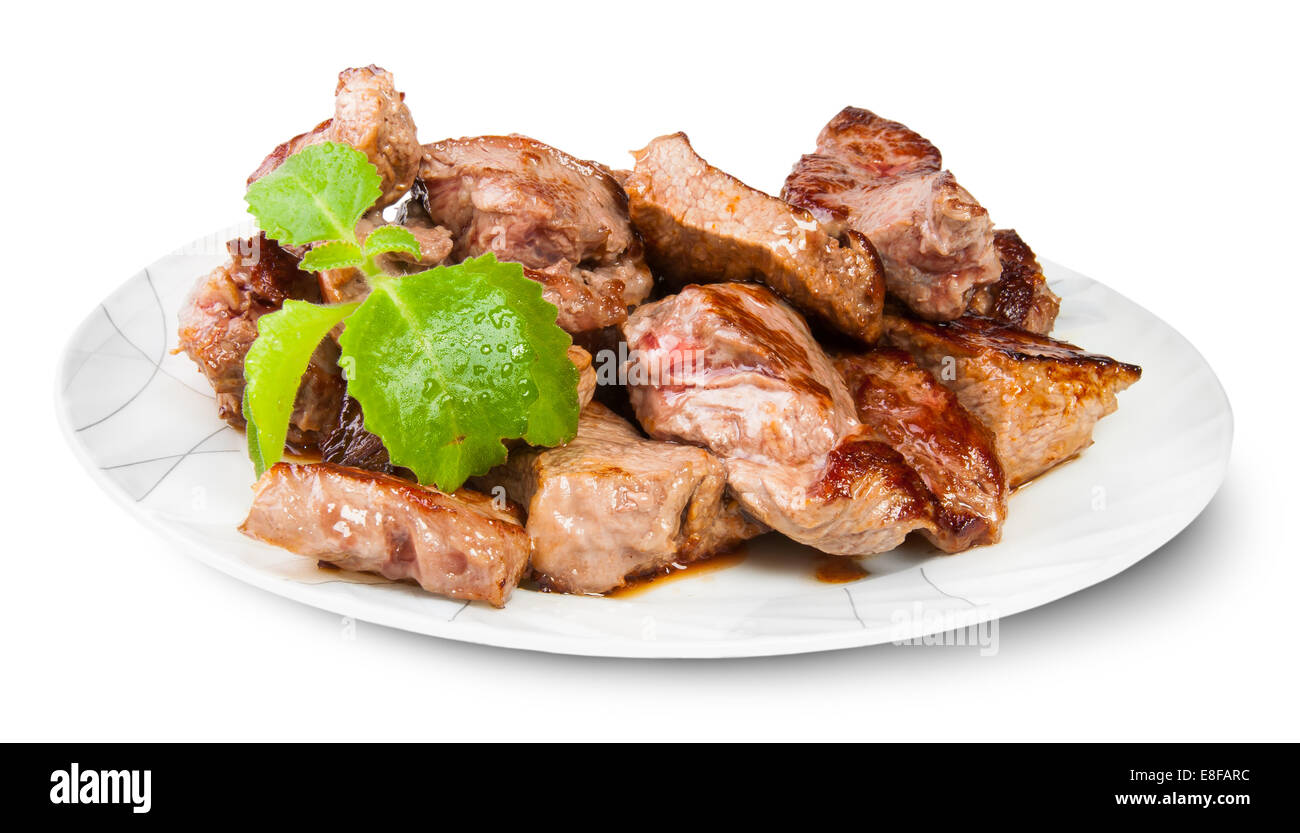 Grilled Meat On A White Plate Served With Mint Leaf Isolated On White ...