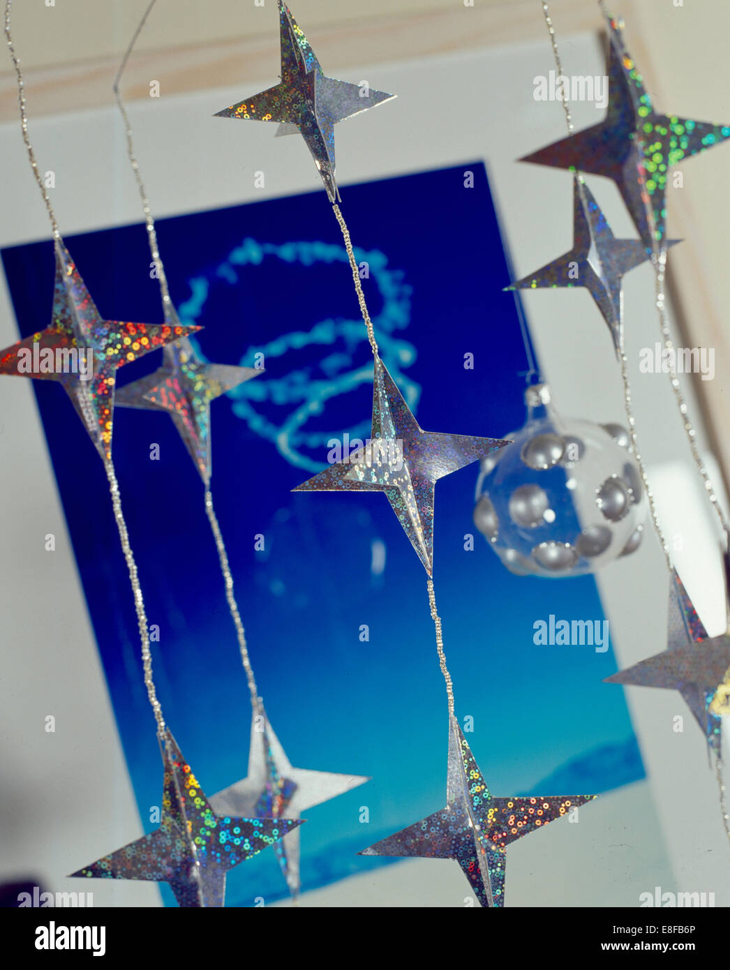 Close-up of a string of Christmas stars hand made from metallic paper ...