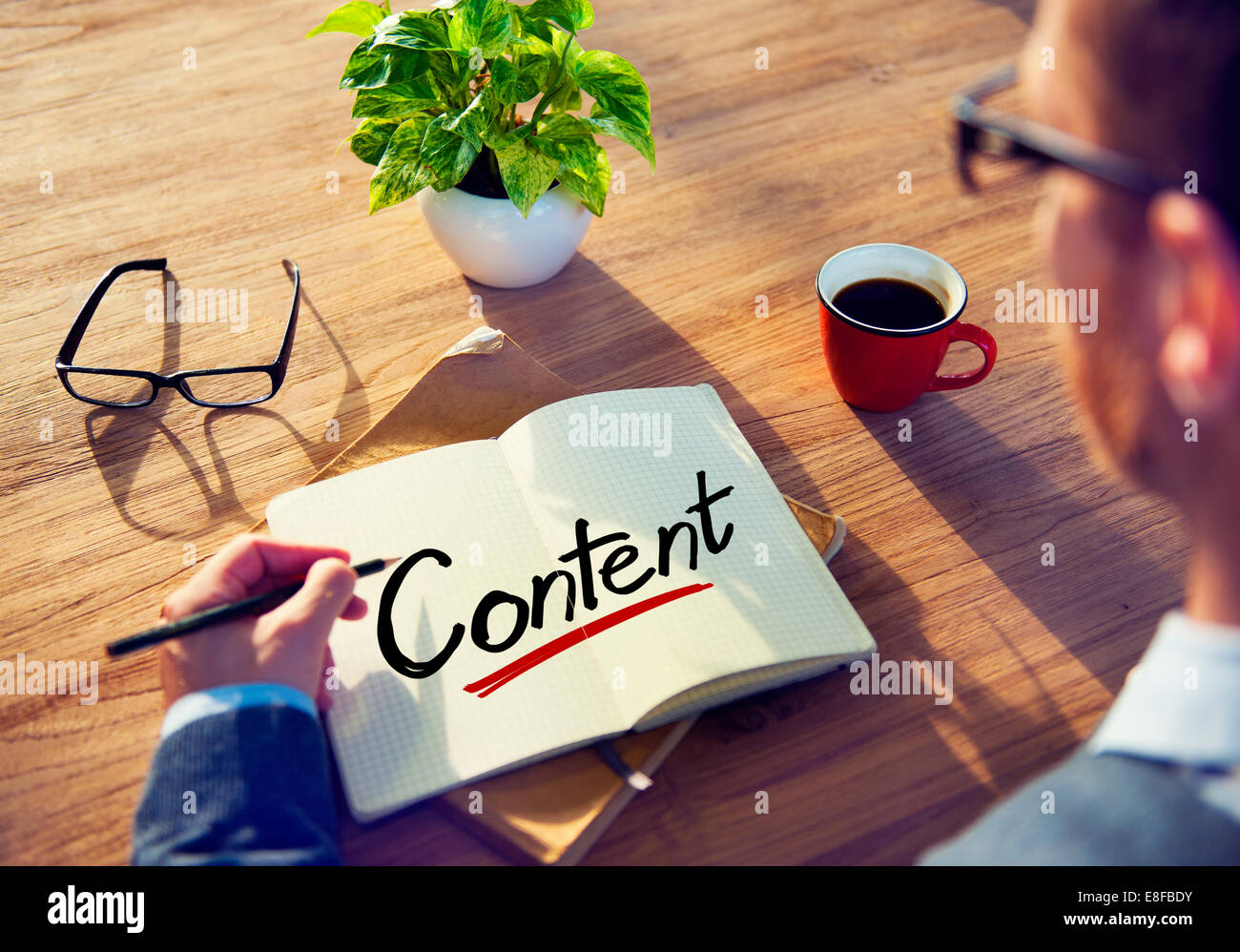 Businessman Writing the Word Content Stock Photo - Alamy