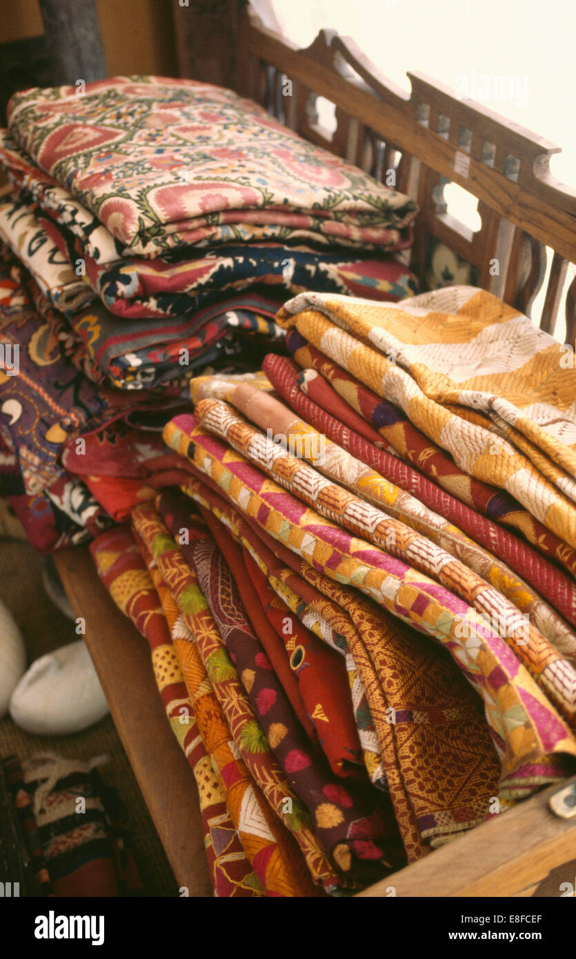 Oriental textiles on shelf in Joss Graham's shop Stock Photo - Alamy