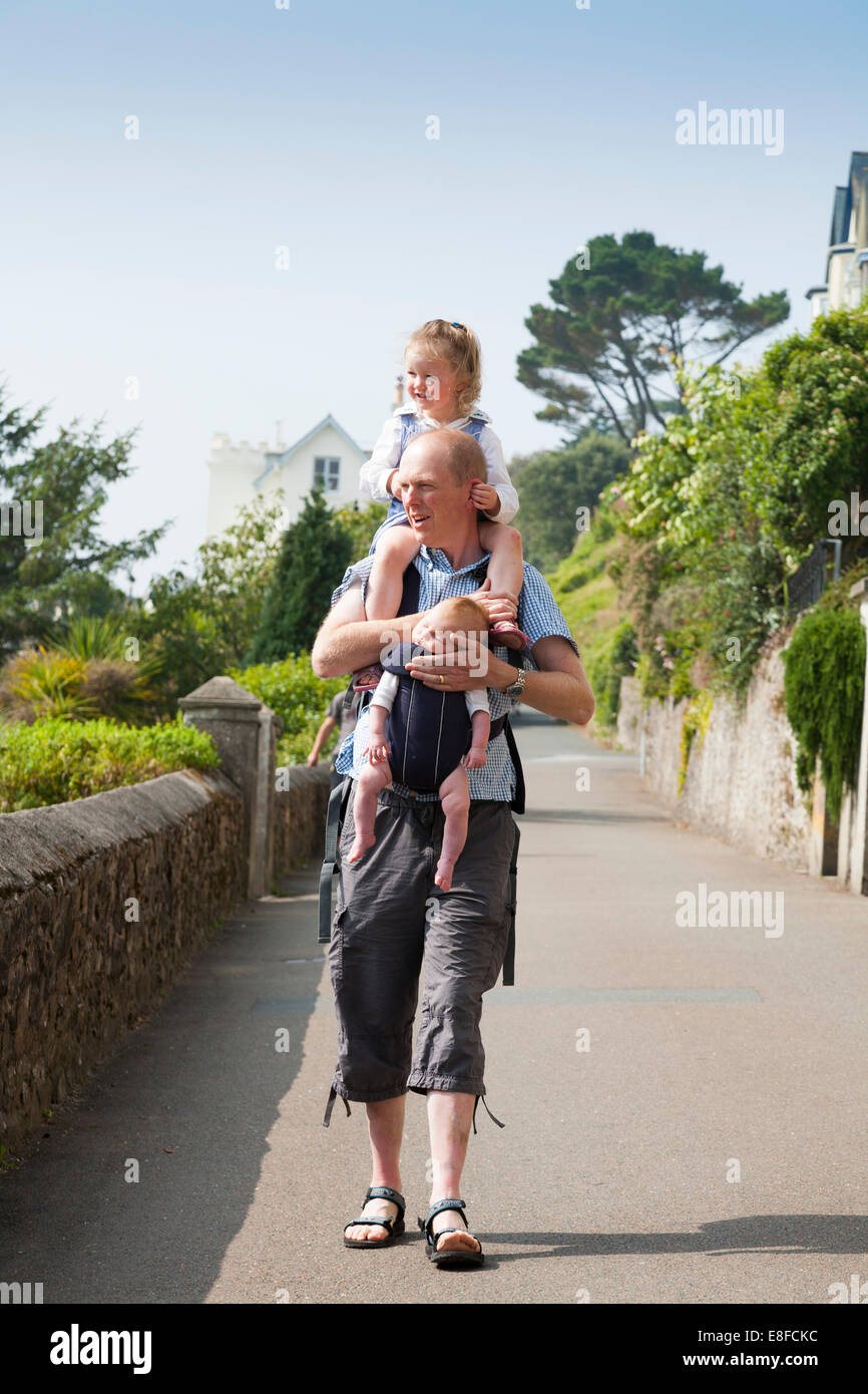 Father walks daughter on shoulders hi-res stock photography and images ...