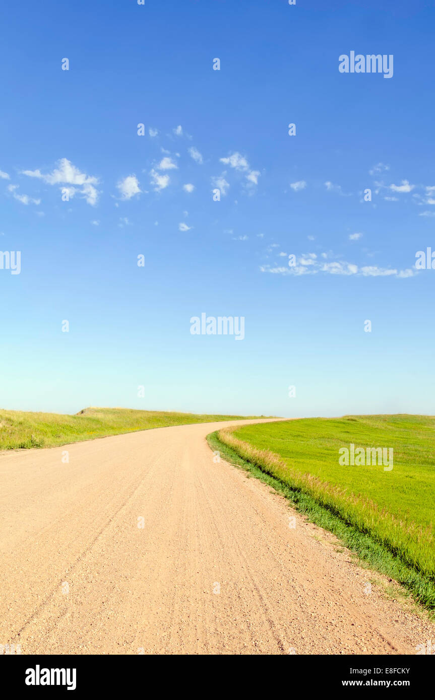 Empty road through rural landscape Stock Photo - Alamy