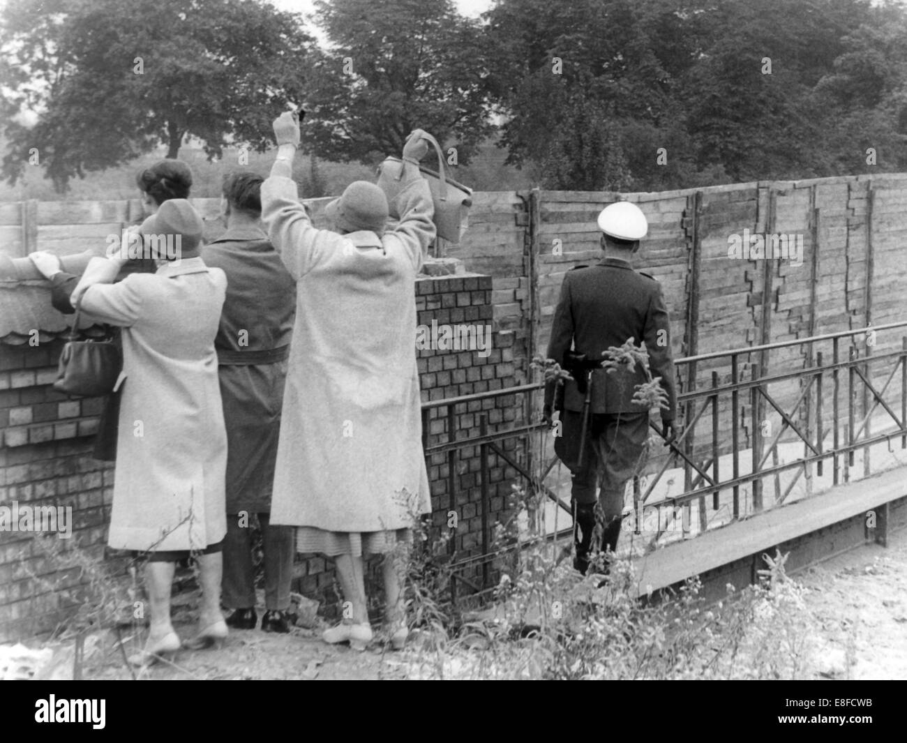A family from West Berlin waves at relatives in East Berlin across ...