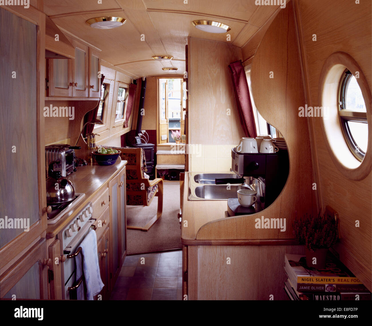 Compact kitchen in traditional narrow boat Stock Photo - Alamy