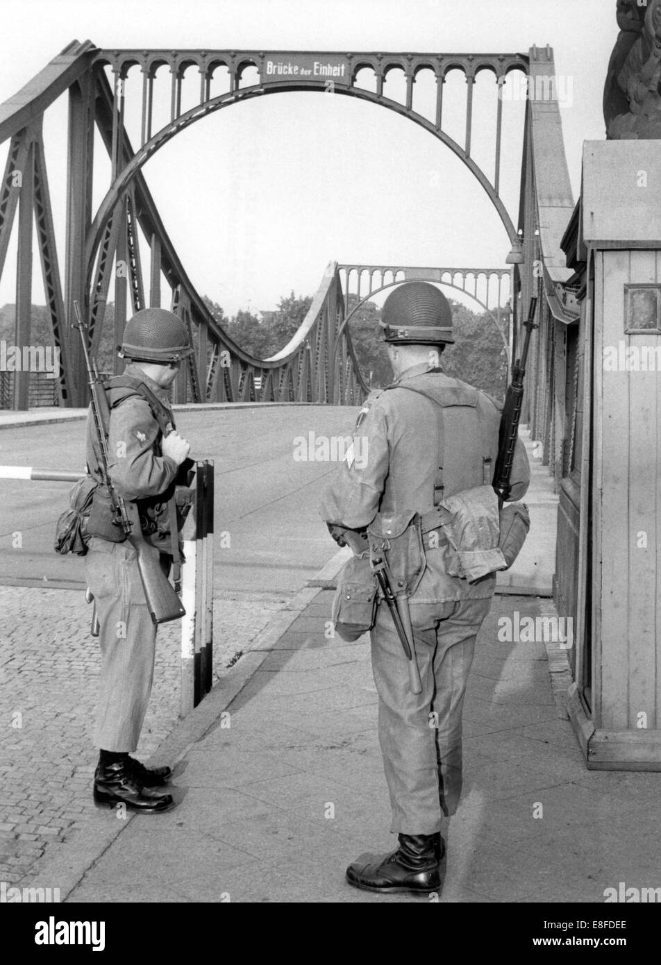 Embattled soldiers of the US Army standing at the checkpoint at ...