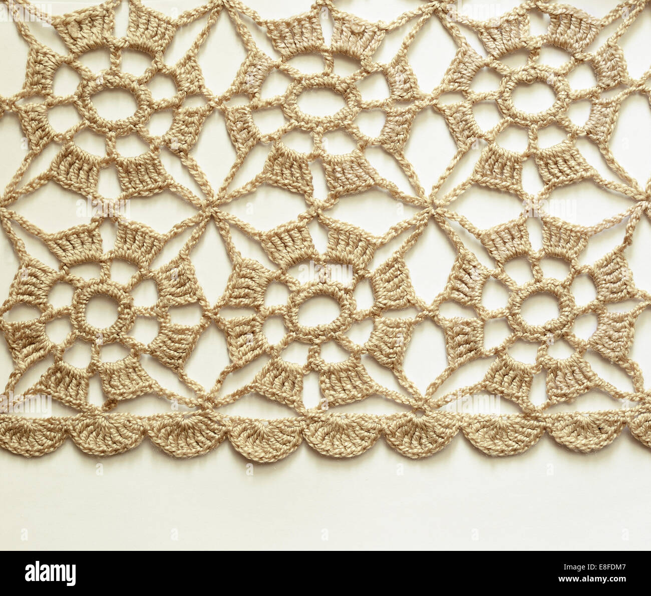 Beige crochet lace on white background Stock Photo - Alamy