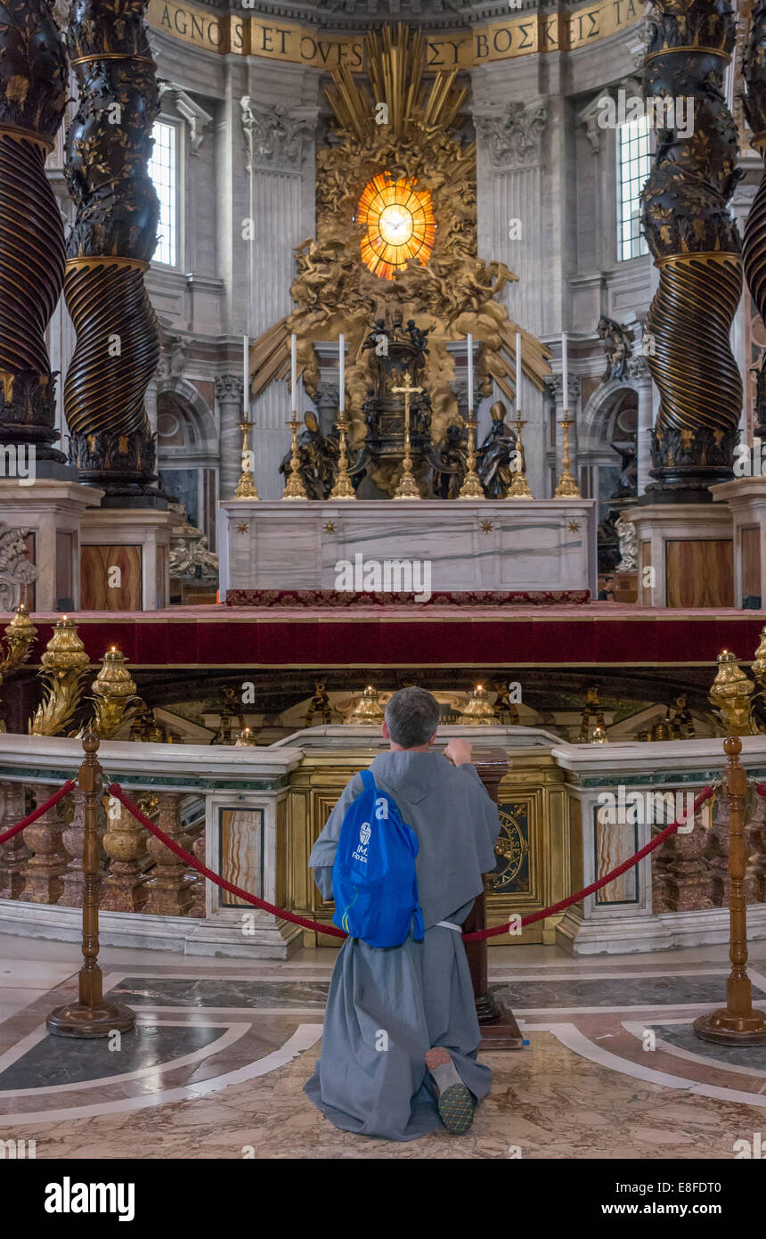 Monk praying in St. Peter´s Basilica Stock Photo - Alamy