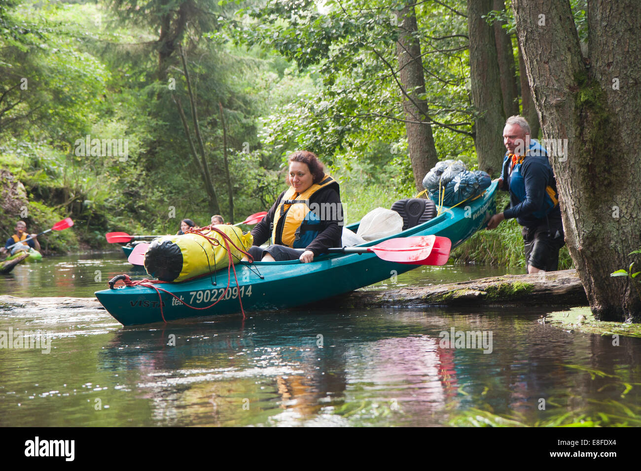 A group of young kayakers. Bystrzyca river Kayaking expedition. Poland ...