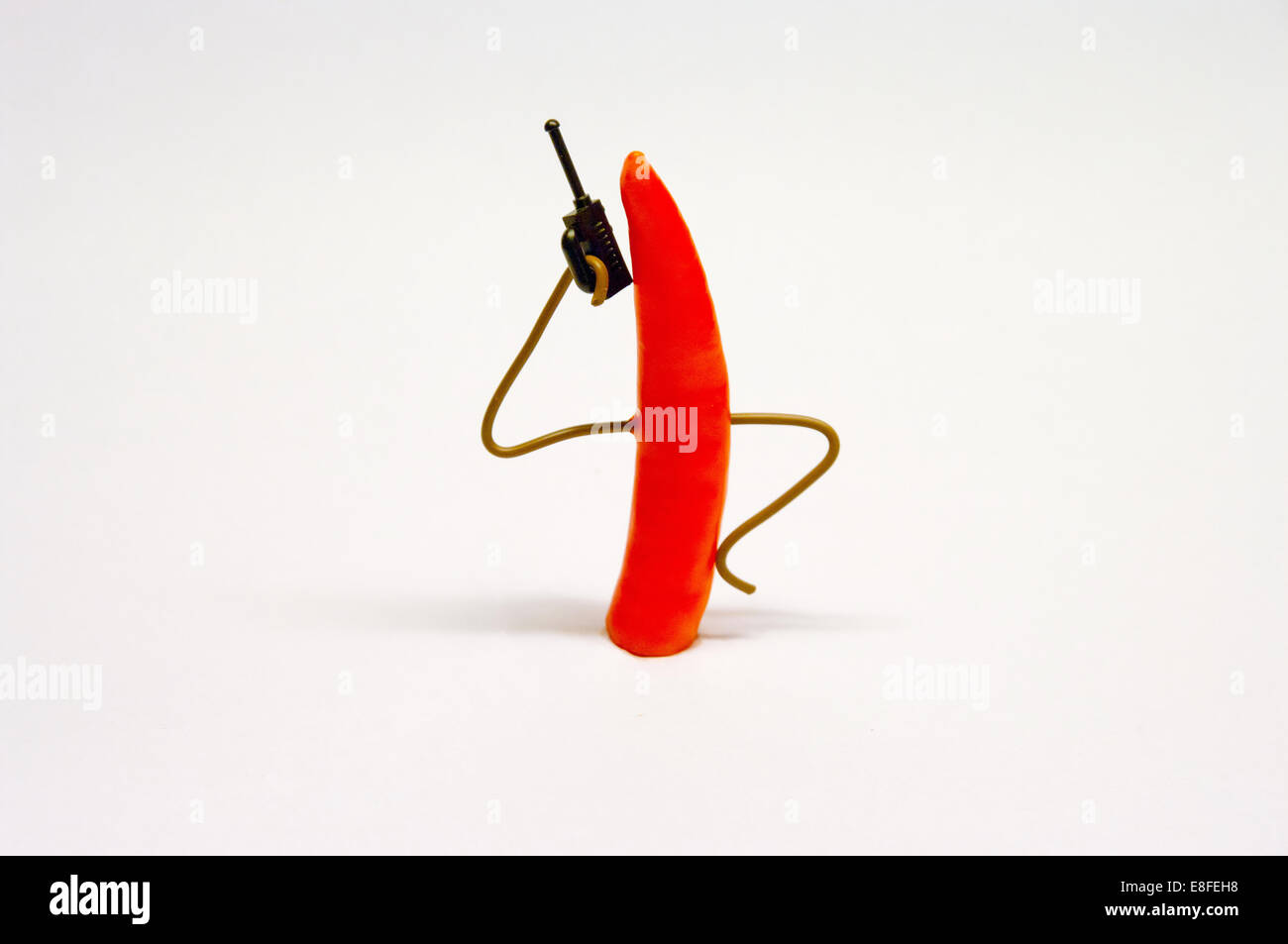 Pepper talking in a Mobile Phone Stock Photo - Alamy