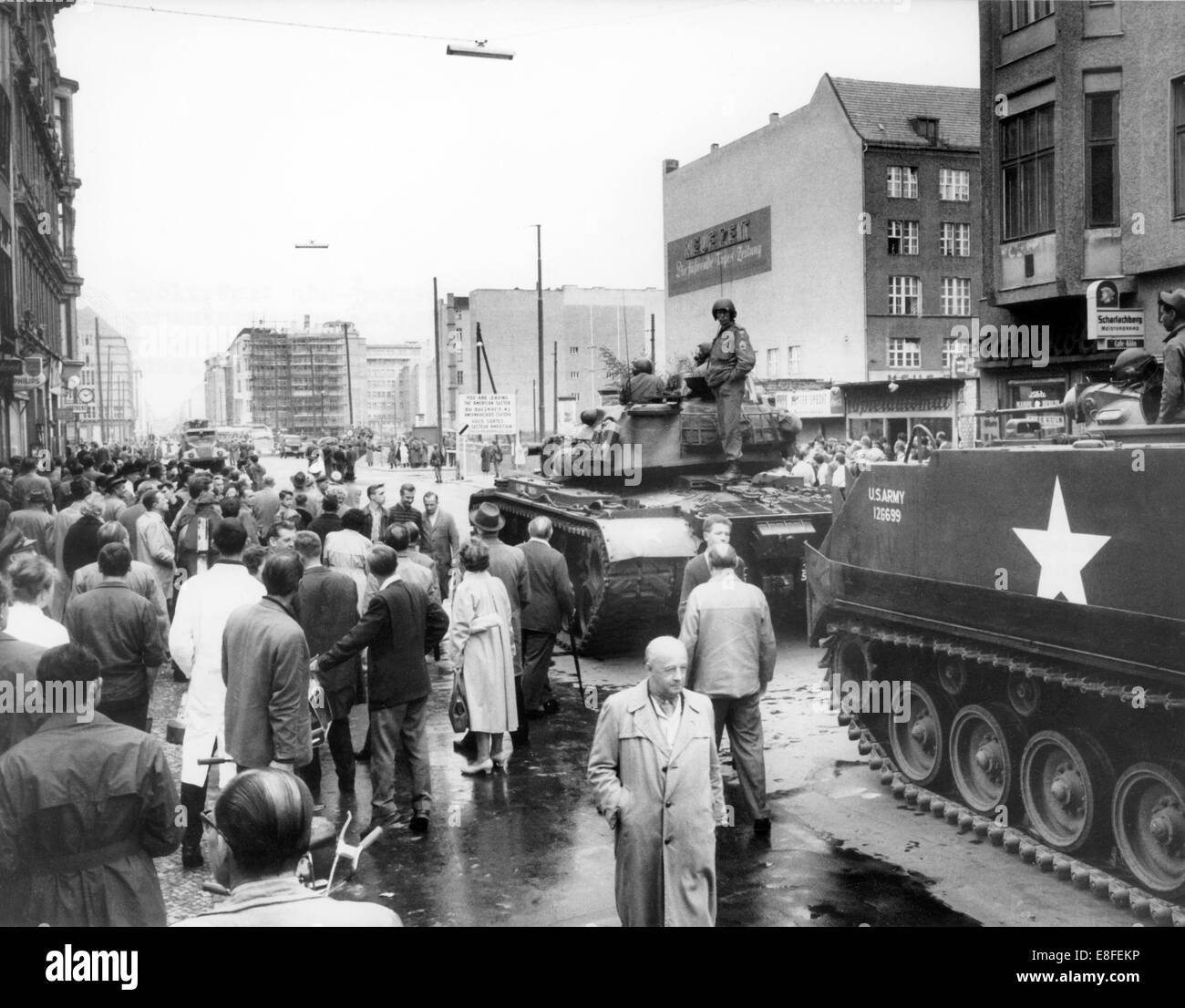 Tanks and soldiers of the US Army standing on the West Berlin side and ...