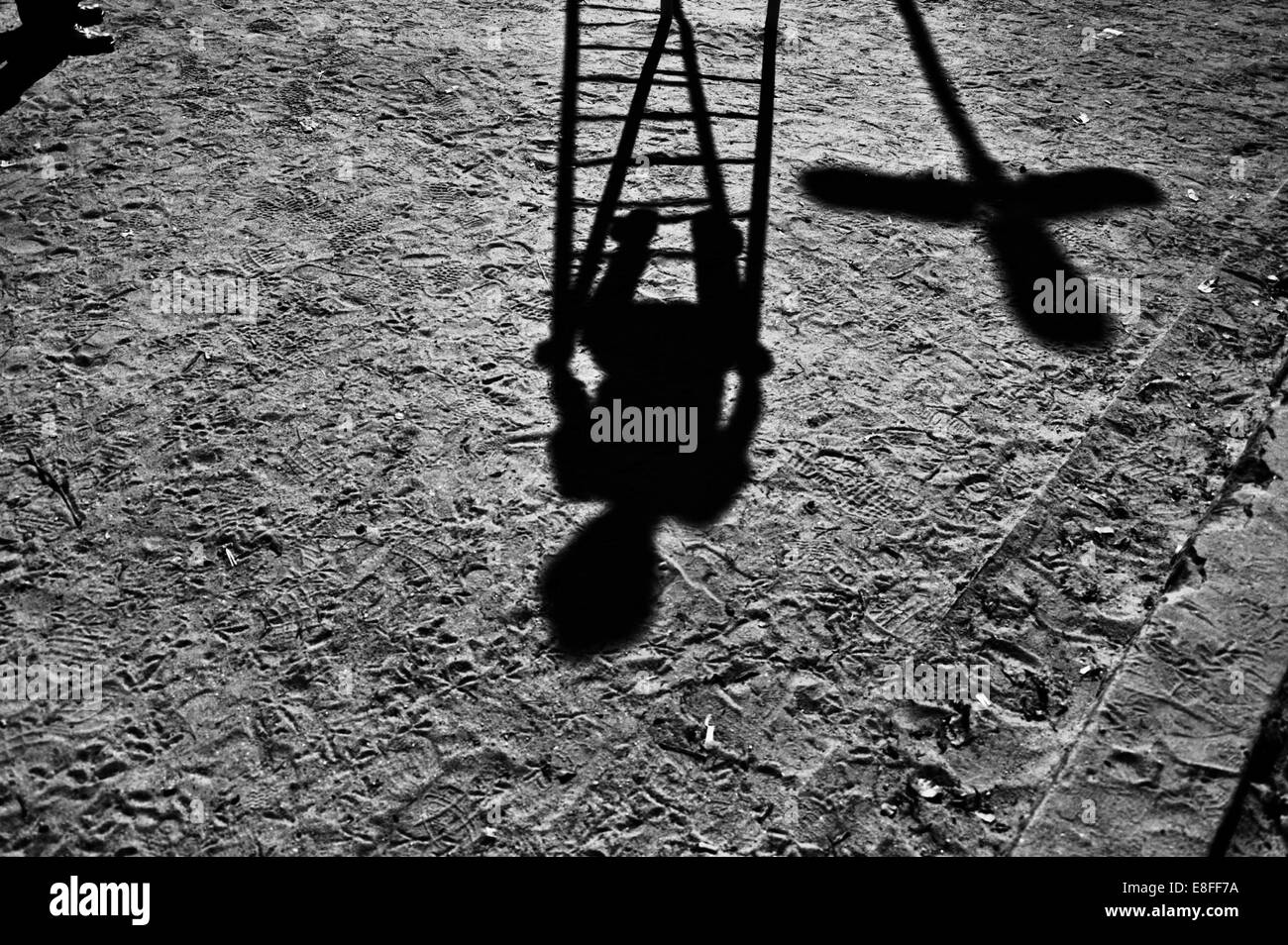 Shadow of a child playing in a playground Stock Photo - Alamy