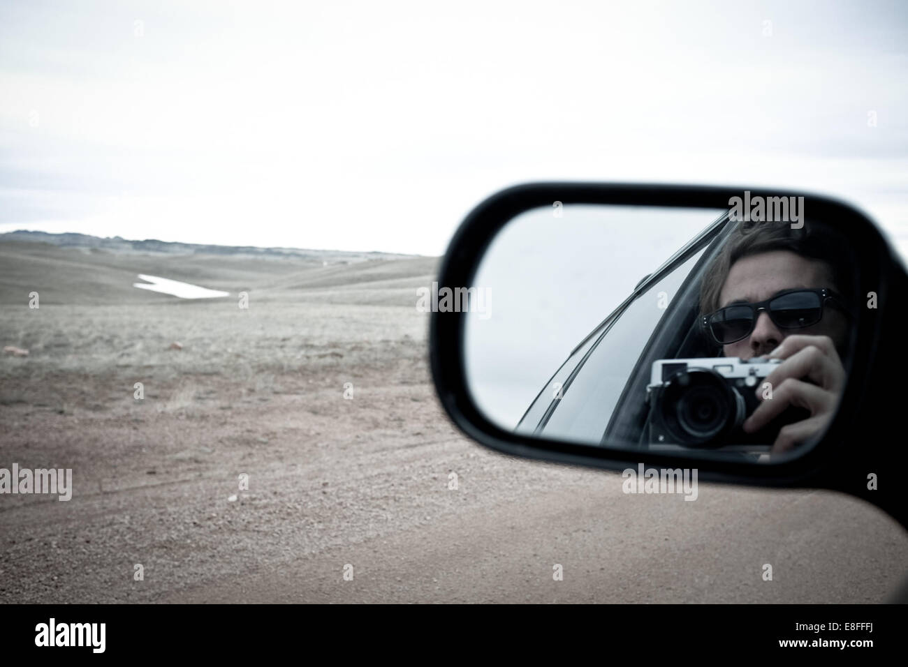 Woman reflecting in side mirror Stock Photo - Alamy