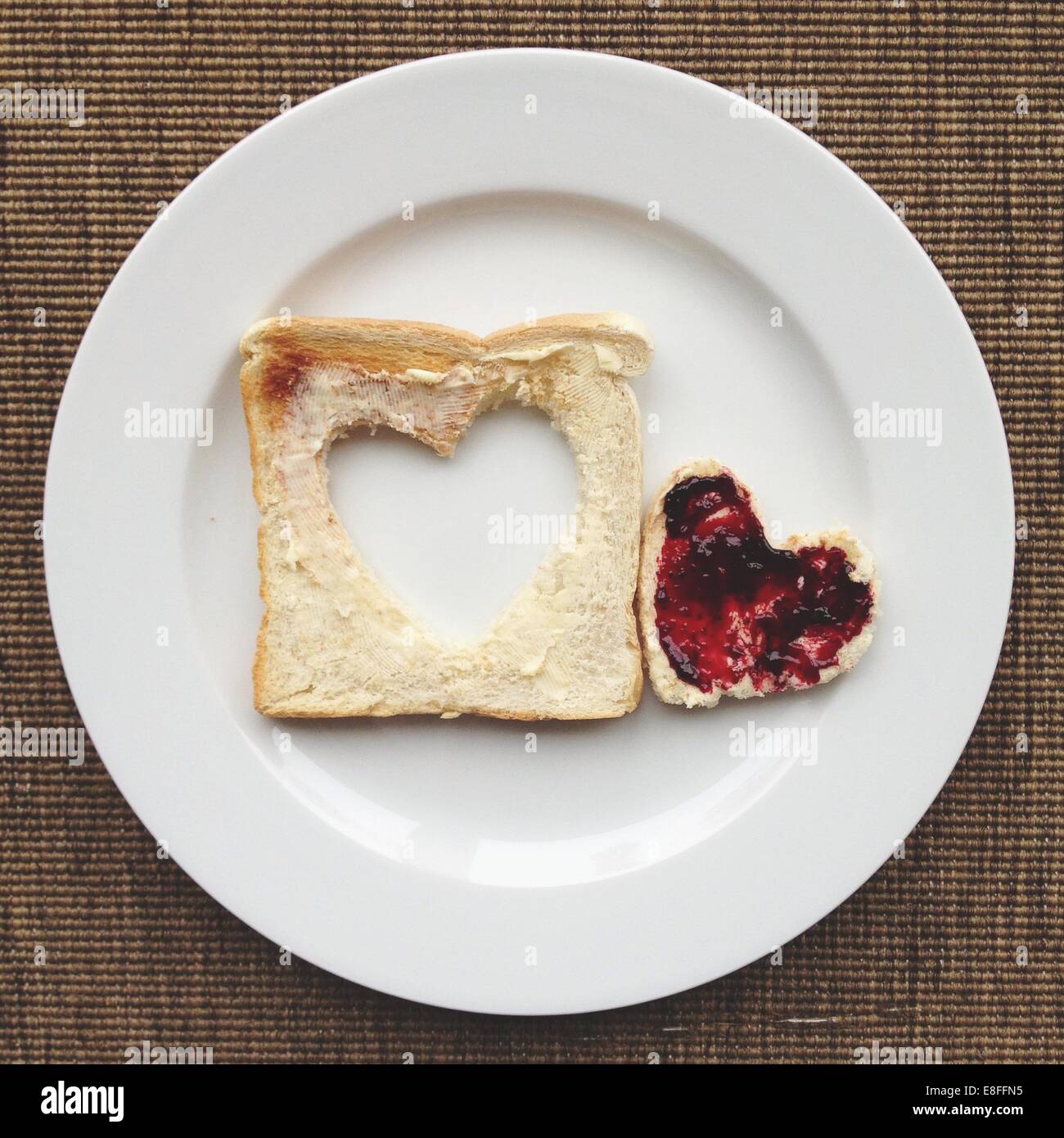 Toast with jam cut in heart shape Stock Photo - Alamy