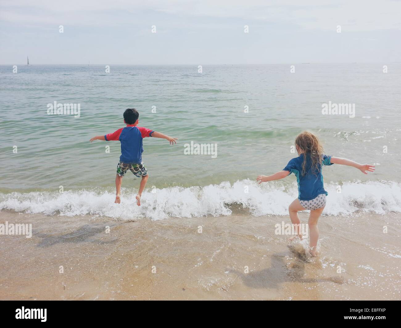 Two girls running away hi-res stock photography and images - Alamy