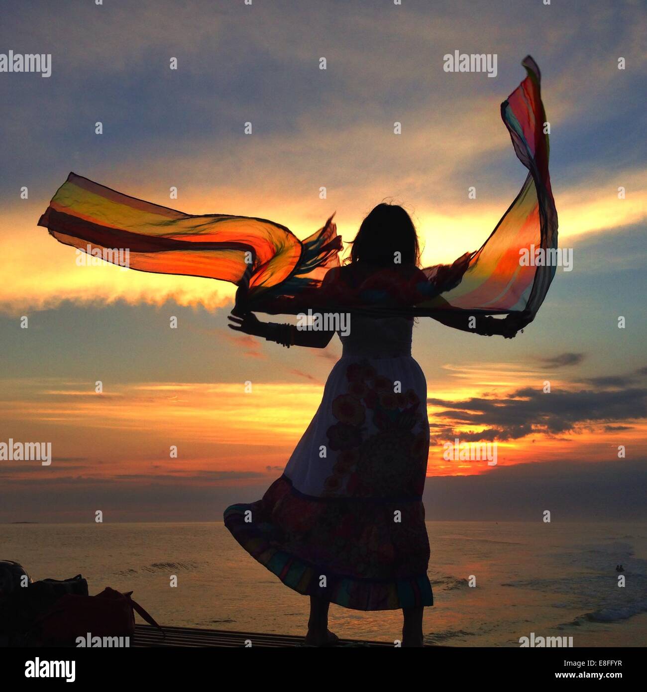 Woman floaty dress rear view hi-res stock photography and images - Alamy