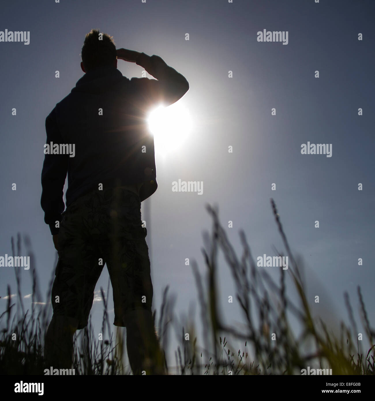 Man looking at the sun hi-res stock photography and images - Alamy