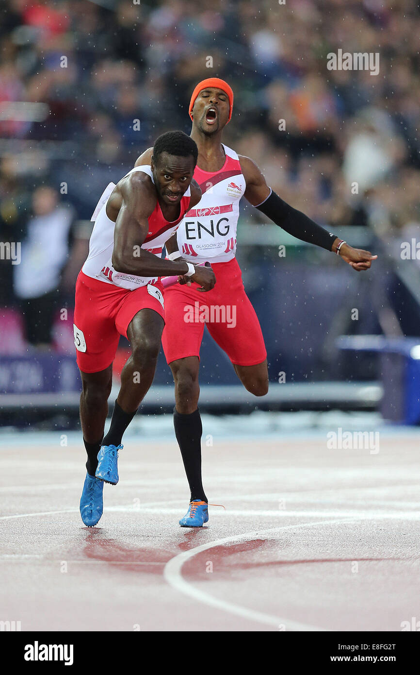 Conrad Williams hands the baton to Michael Bingham (both ENG). England ...