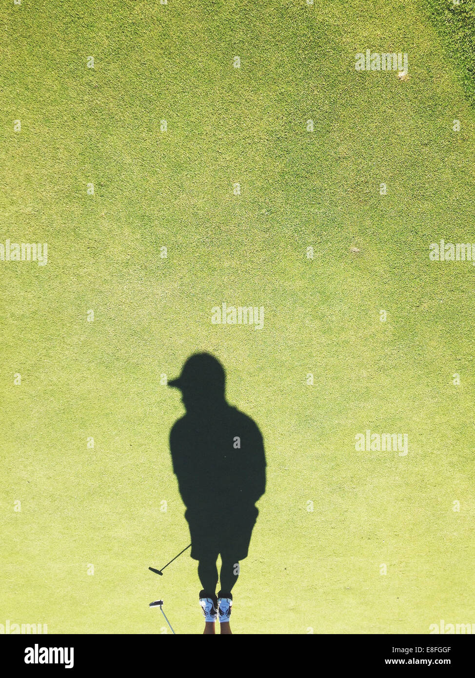 Shadow of man playing golf Stock Photo - Alamy
