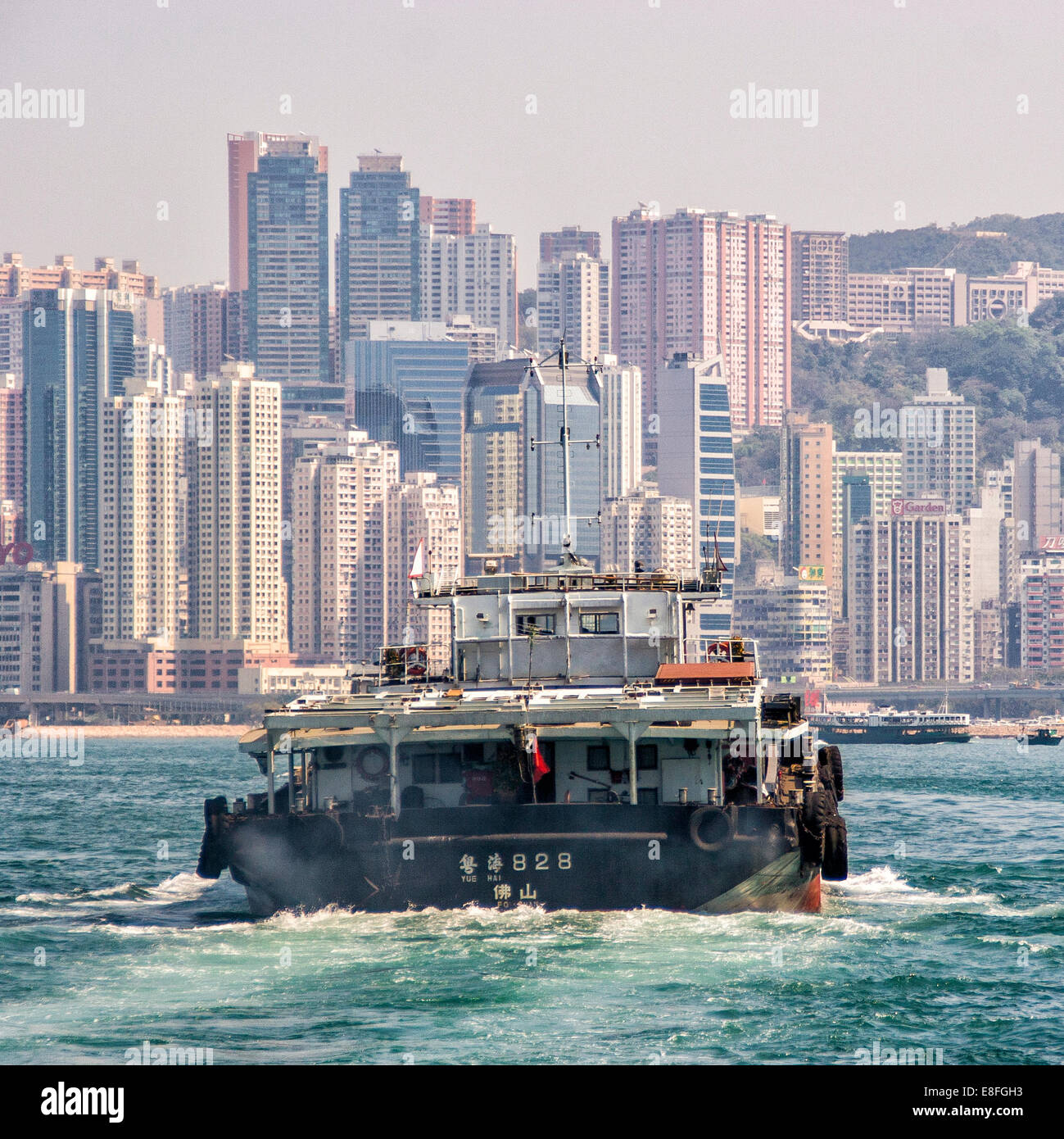Hong Kong, Boat heading to port Stock Photo - Alamy