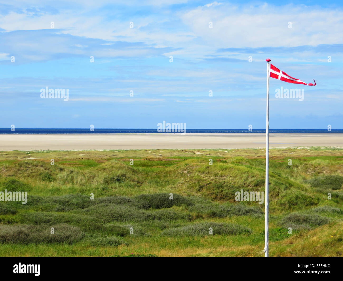 Beach with Danish flag, Fanoe, Jutland, Denmark Stock Photo - Alamy