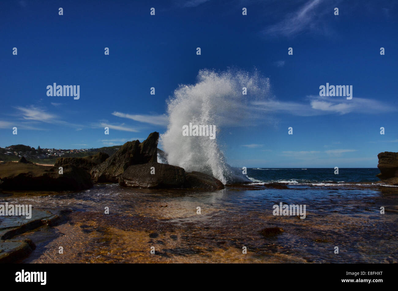 Waves crashing onto rocks Stock Photo - Alamy