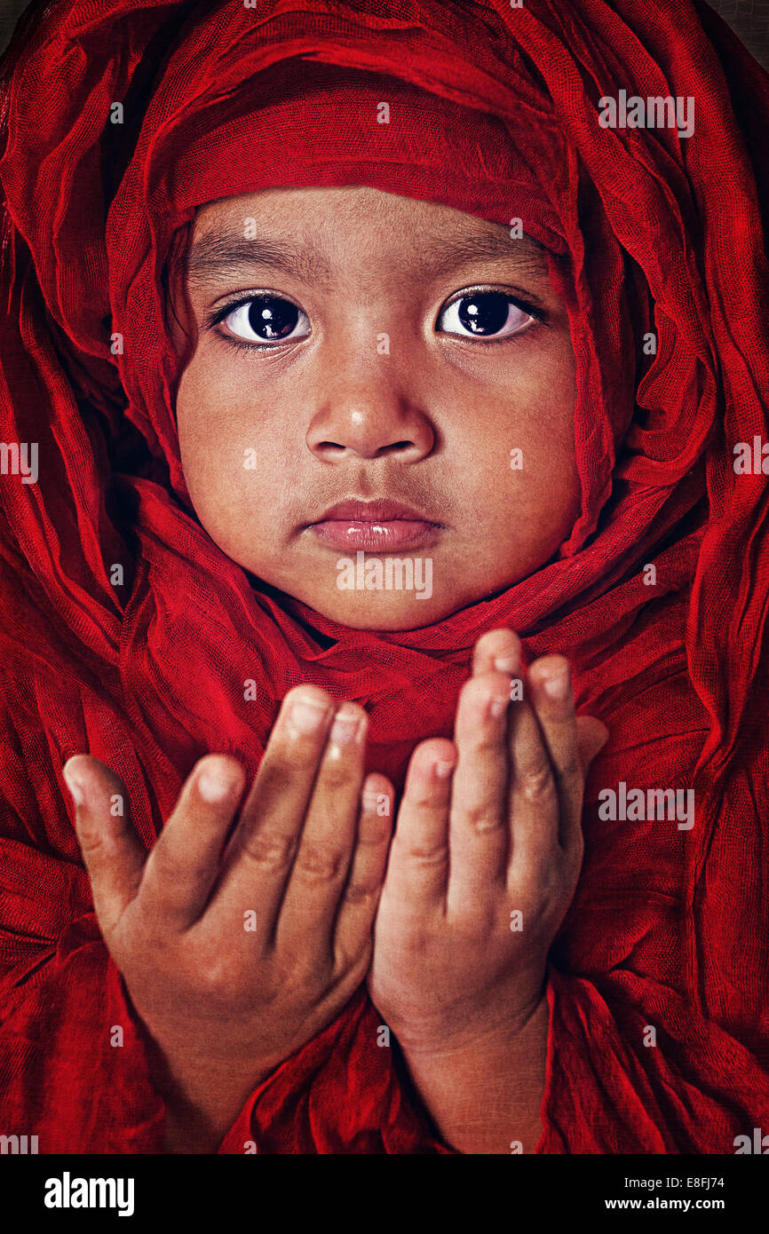 Portrait of a girl praying Stock Photo - Alamy