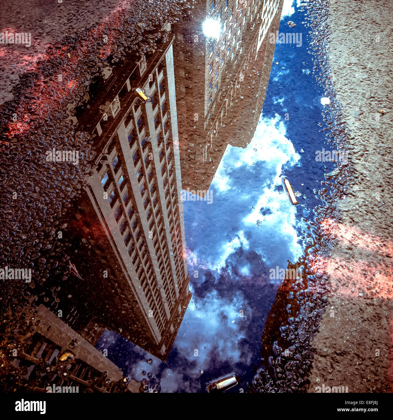 Skyscraper reflections in puddle, New York, United States Stock Photo ...