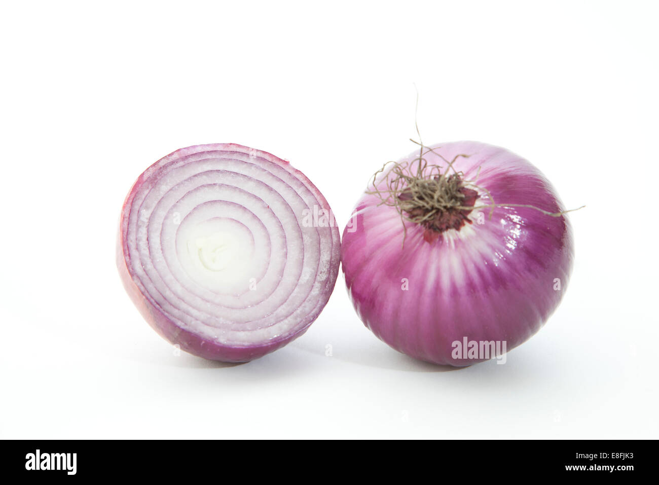 Close-up of a peeled Red Onion and half an onion Stock Photo - Alamy