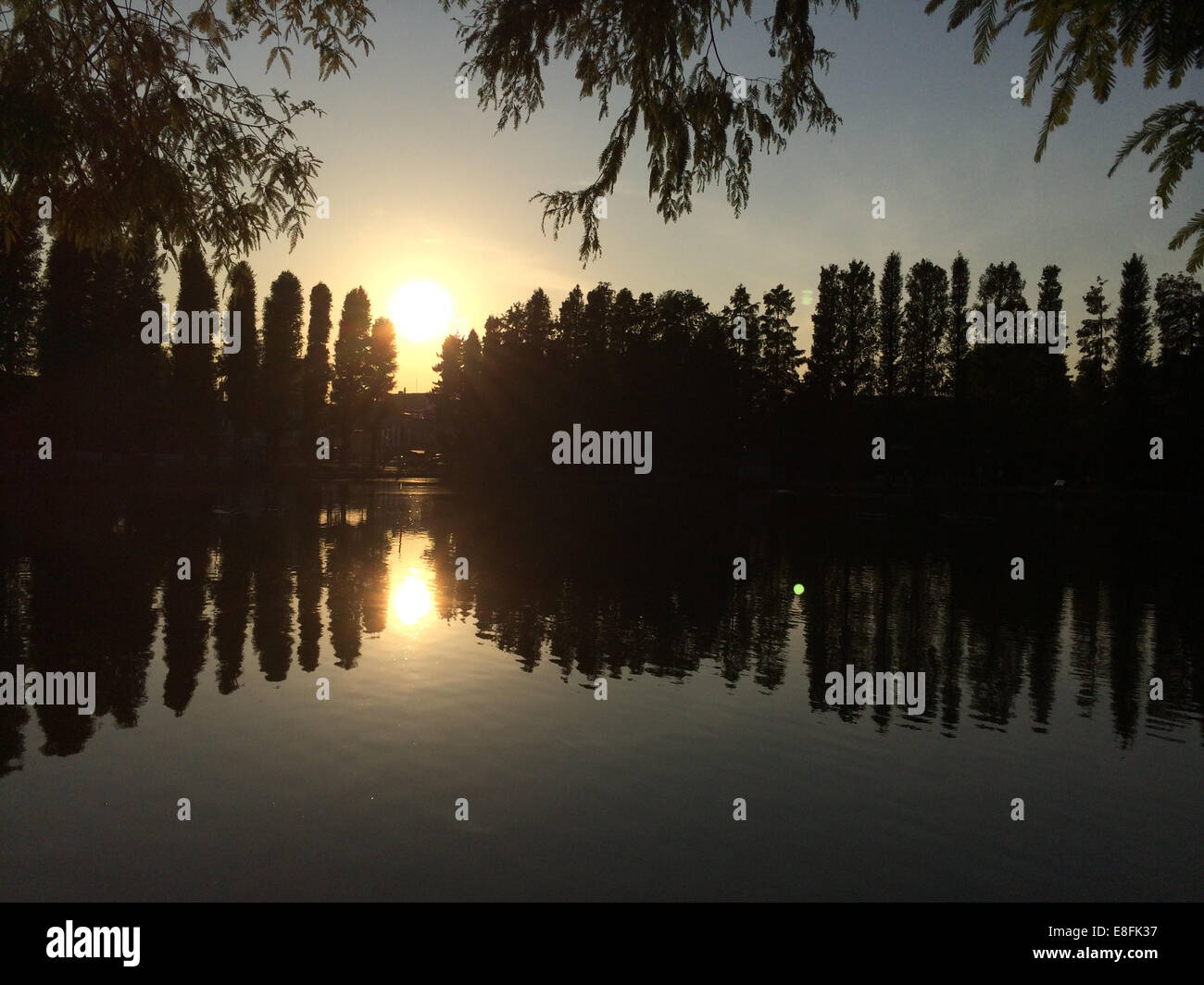 Sunset Reflections In Lake Stock Photo - Alamy