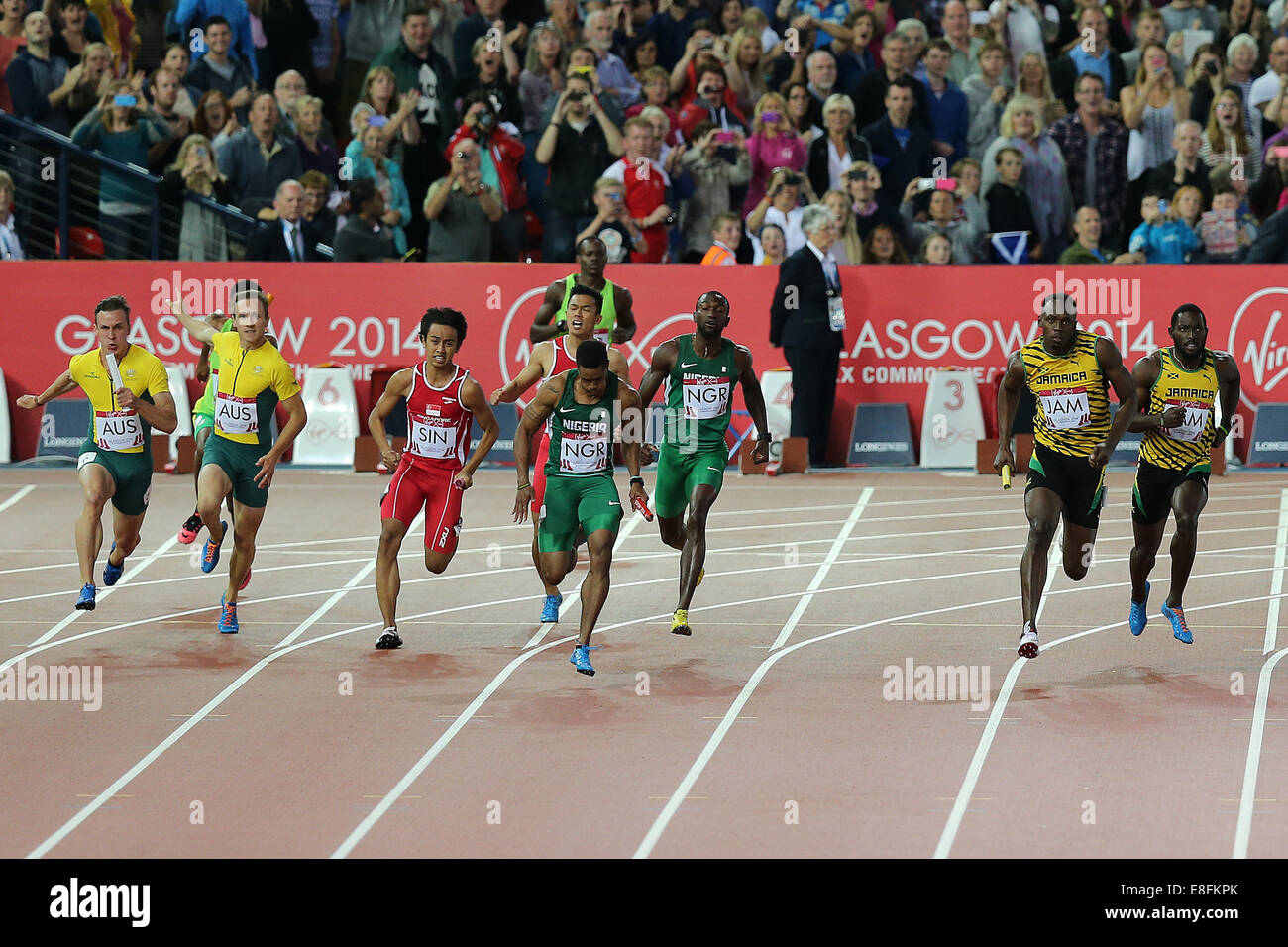 Usain Bolt (JAM) runs the fourth leg and helps his team qualify ...