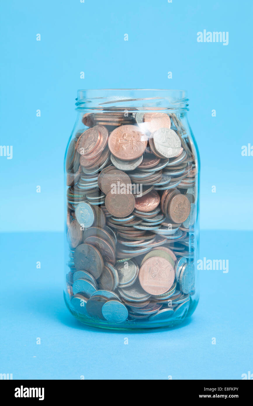 Studio shot jar full coins hi-res stock photography and images - Alamy