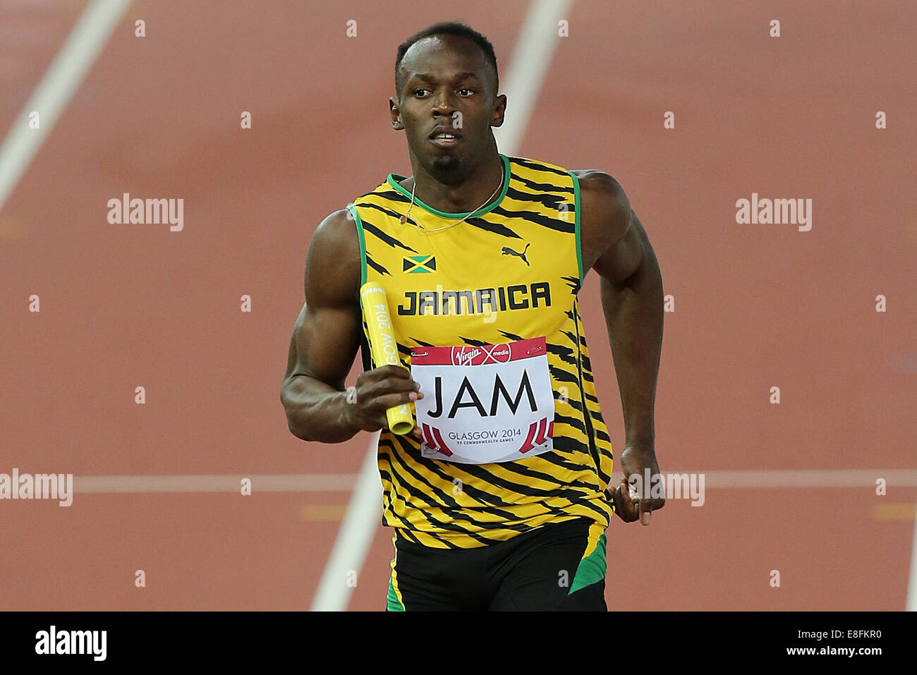Usain Bolt (JAM) runs the fourth leg and helps his team qualify ...