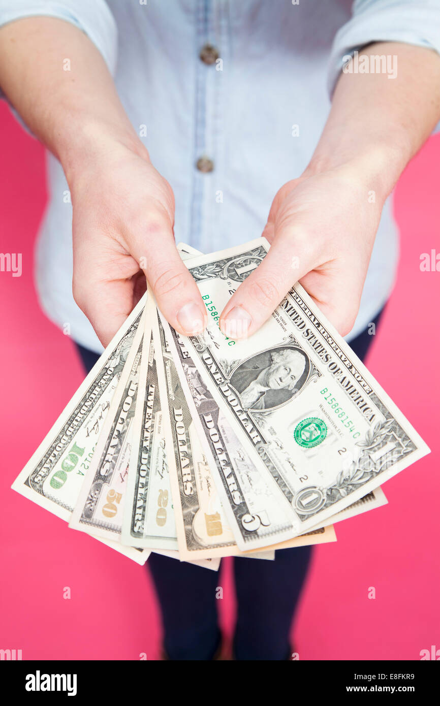 Hands Holding Us Dollar Notes Stock Photo - Alamy