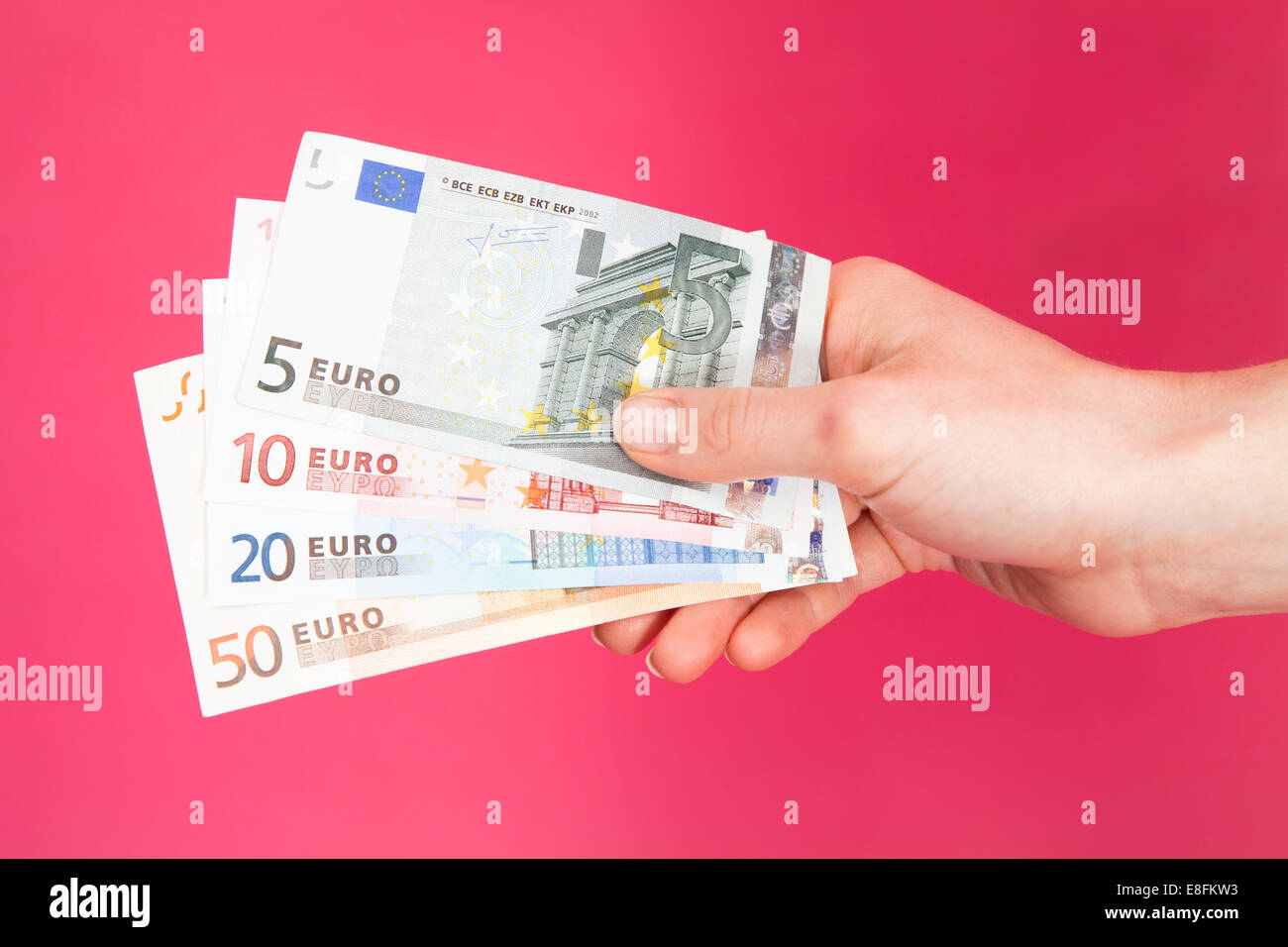 Hand holding euro bank notes Stock Photo - Alamy