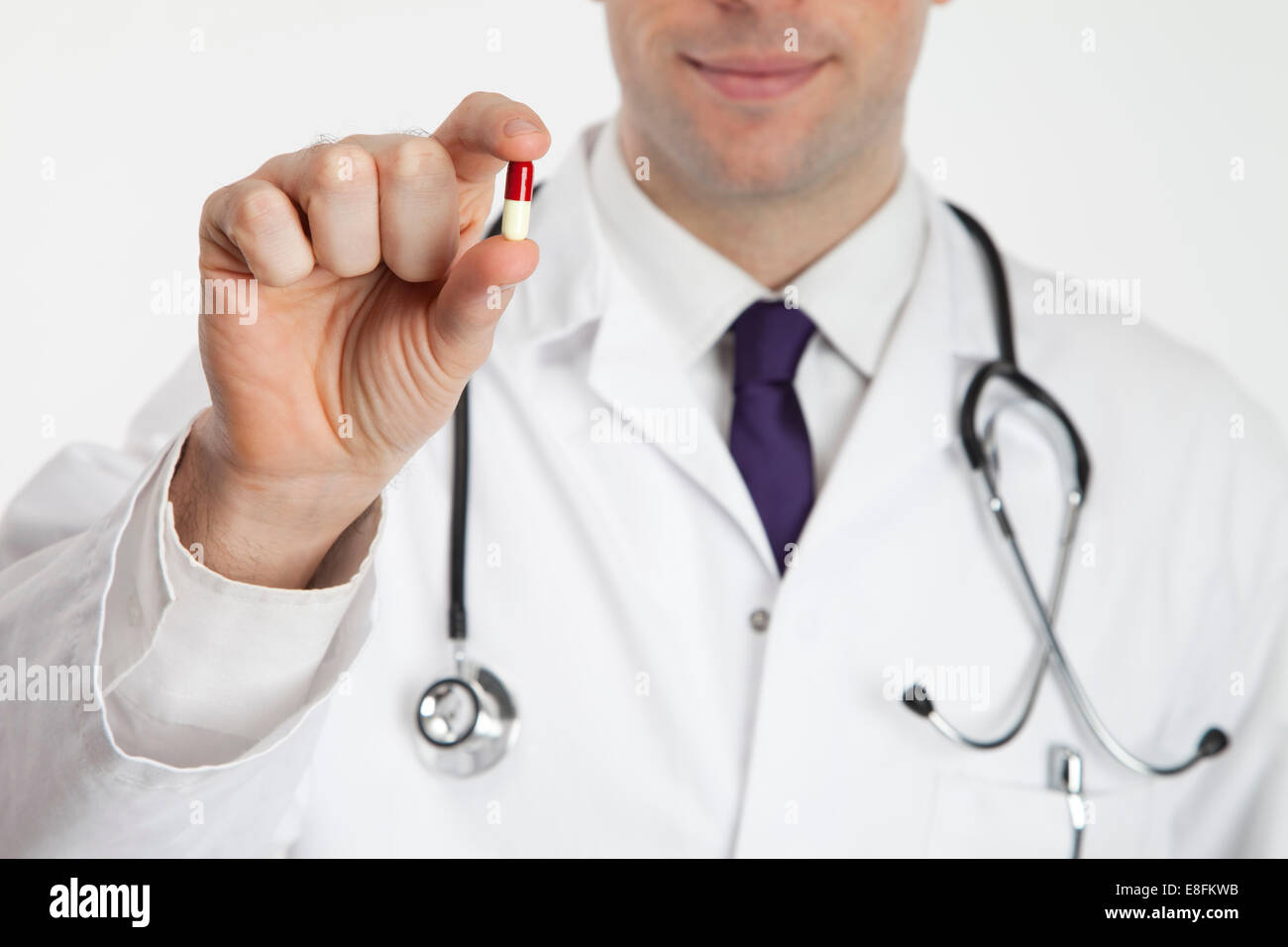 Close-up of a male doctor holding a capsule Stock Photo - Alamy