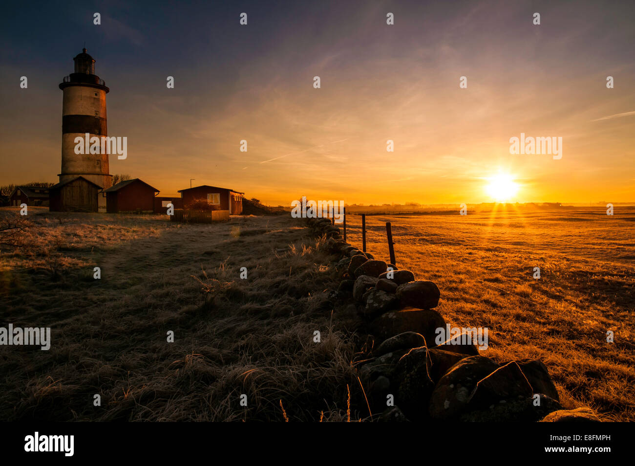 Lighthouse at sunrise Stock Photo - Alamy