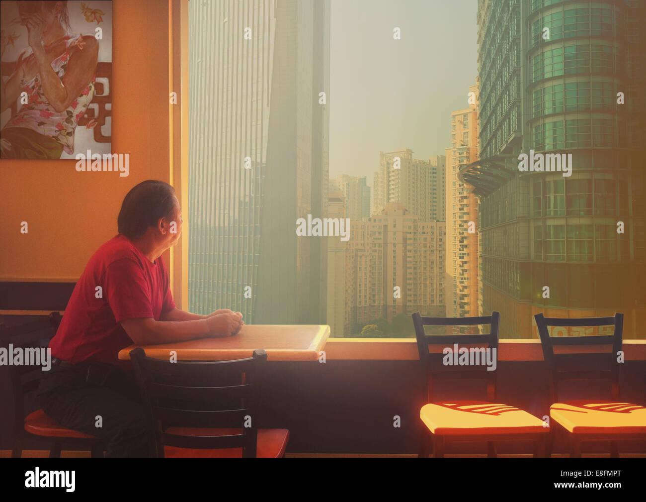 China, Shanghai, Man sitting at table Stock Photo - Alamy