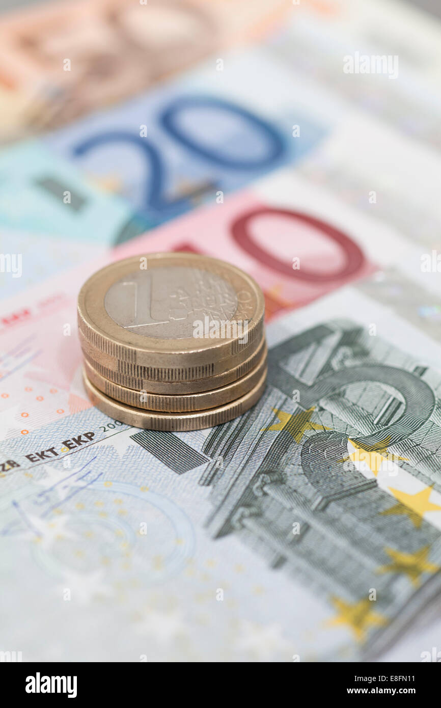Stack of Euro coins on euro banknotes Stock Photo - Alamy
