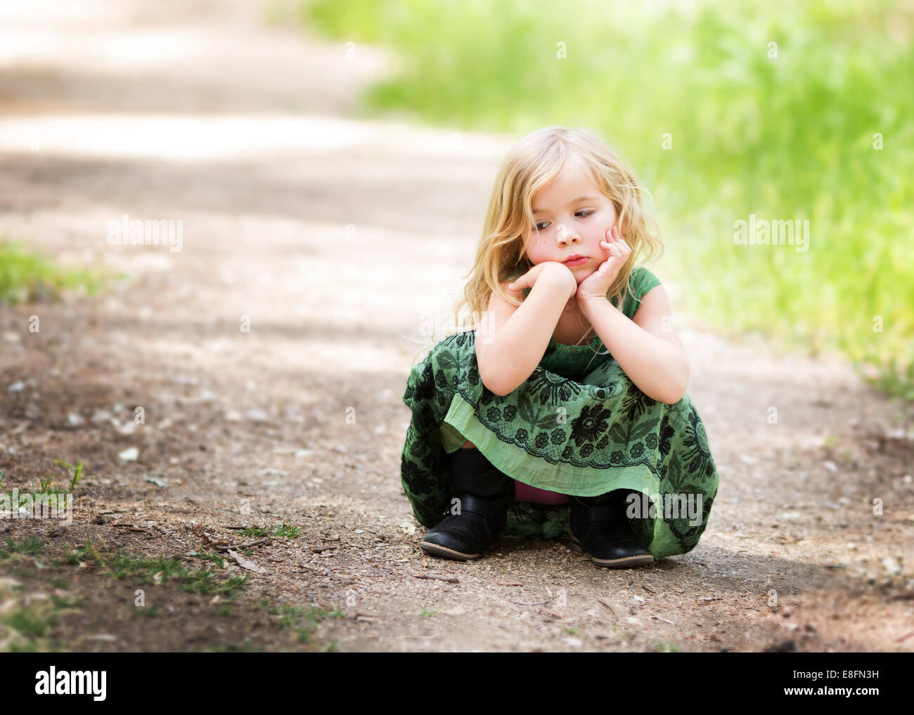 Crouching down sad hi-res stock photography and images - Alamy