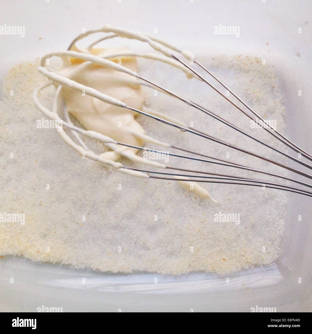 Whisk mixing cream and sugar Stock Photo - Alamy