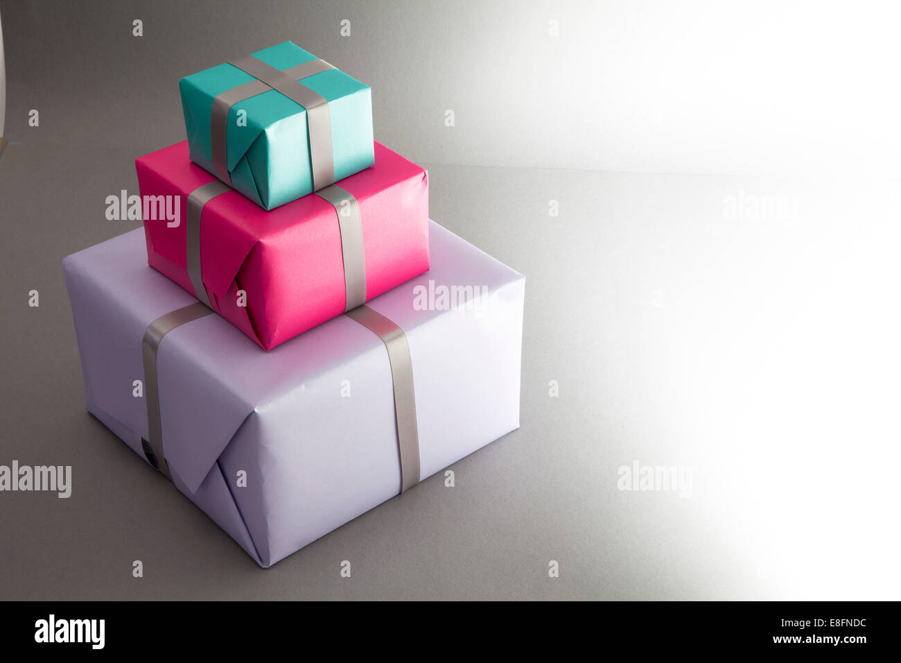 Stack of three wrapped gifts Stock Photo - Alamy