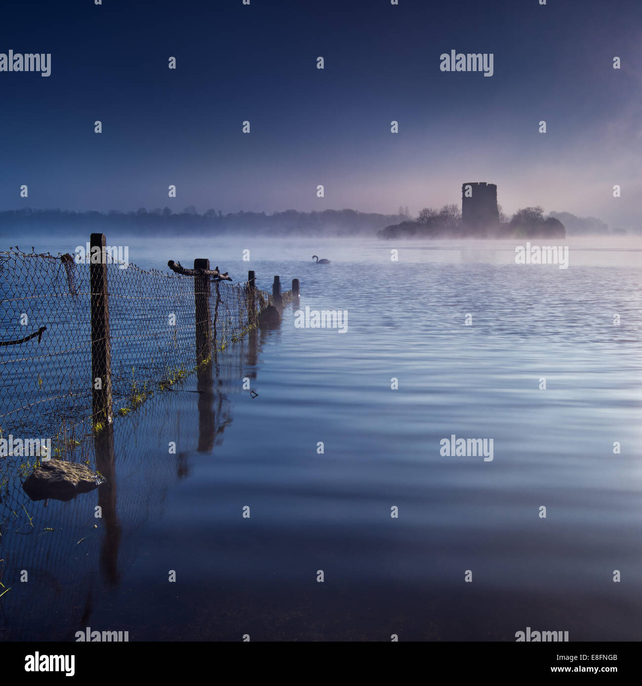 Ireland, Clough Oughter Castle, Peaceful morning at lake Stock Photo ...