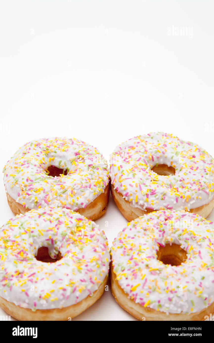 Close-up of Four Doughnuts Stock Photo - Alamy