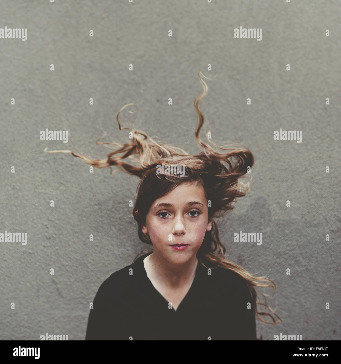 Portrait of a girl with windswept hair Stock Photo - Alamy