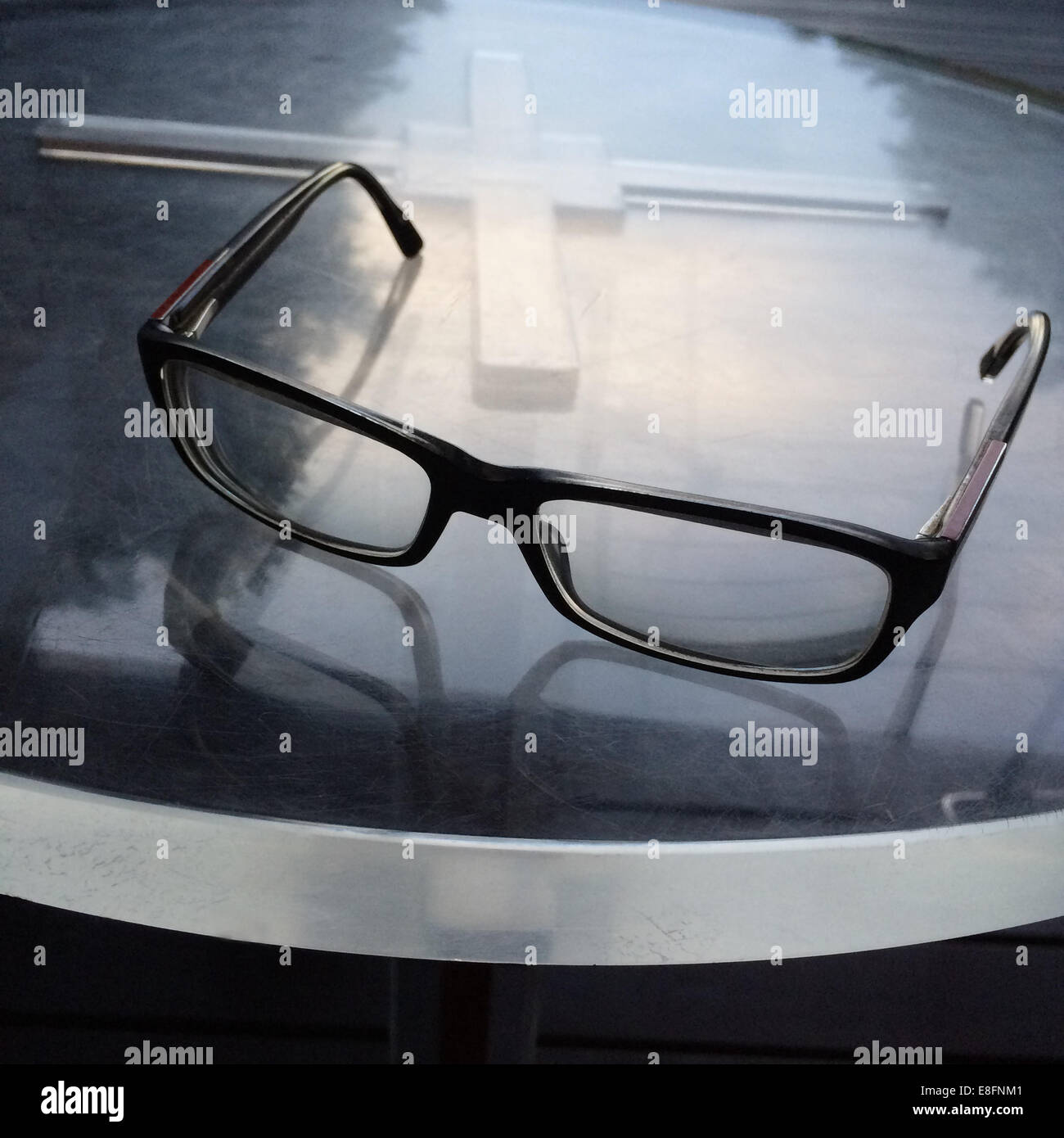 Eyeglasses on table Stock Photo - Alamy