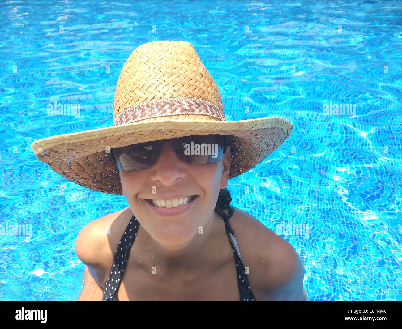 Smiling woman in swimming pool Stock Photo - Alamy