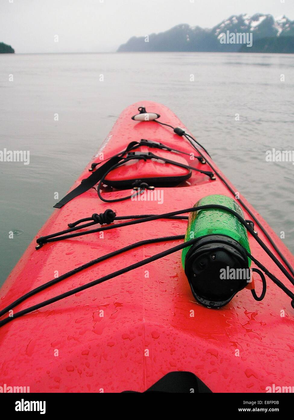 View of mountain coastline from kayak, Kenai Fjords National park ...
