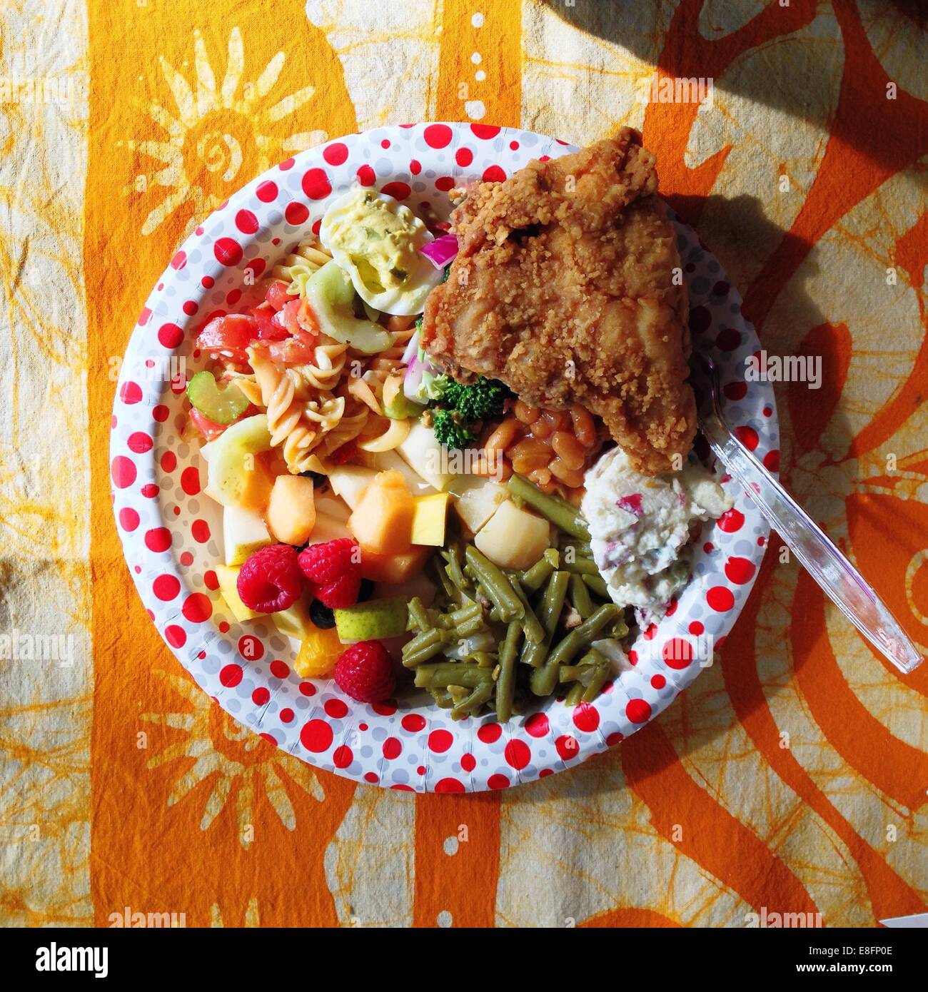 Plate of buffet food on tablecloth Stock Photo - Alamy