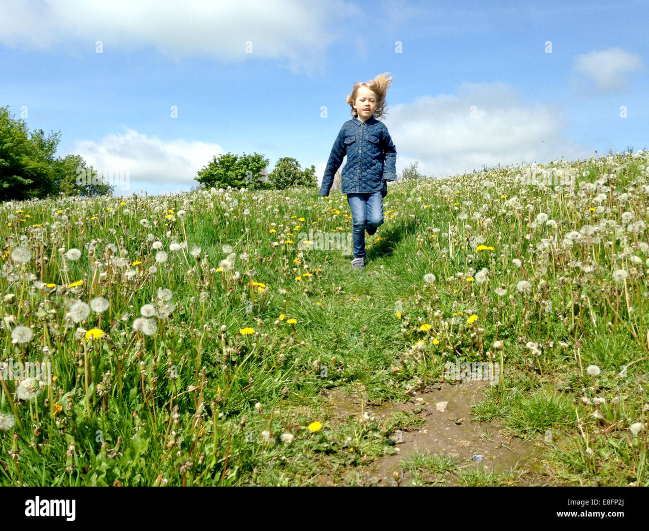 Children running through meadow hi-res stock photography and images - Alamy